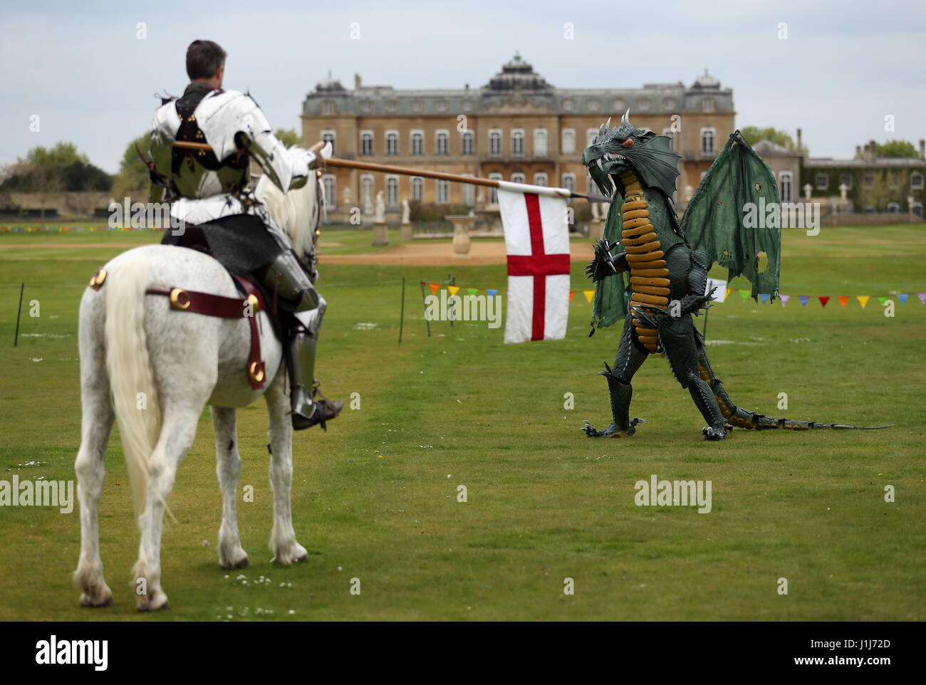 Performers act out the legend of St George and the dragon during a ...