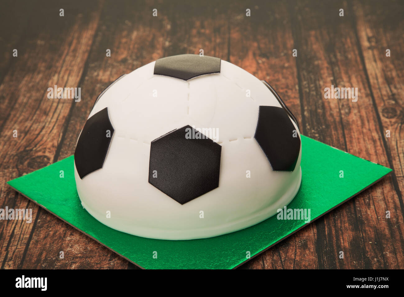 A football shaped cake Stock Photo - Alamy