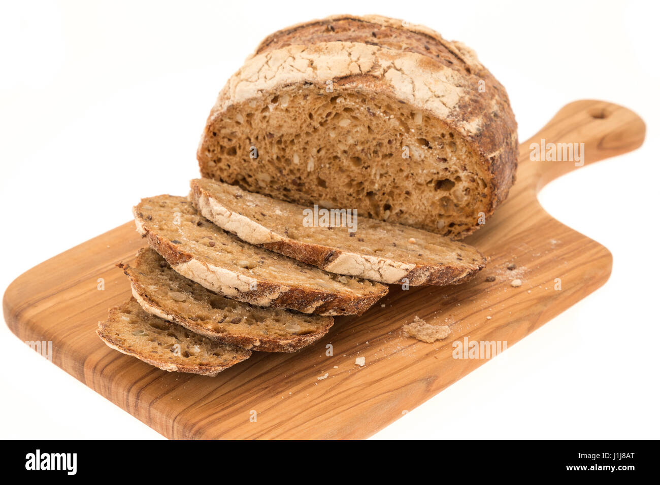 A sliced sourdough bread loaf - studio shot with a white background ...