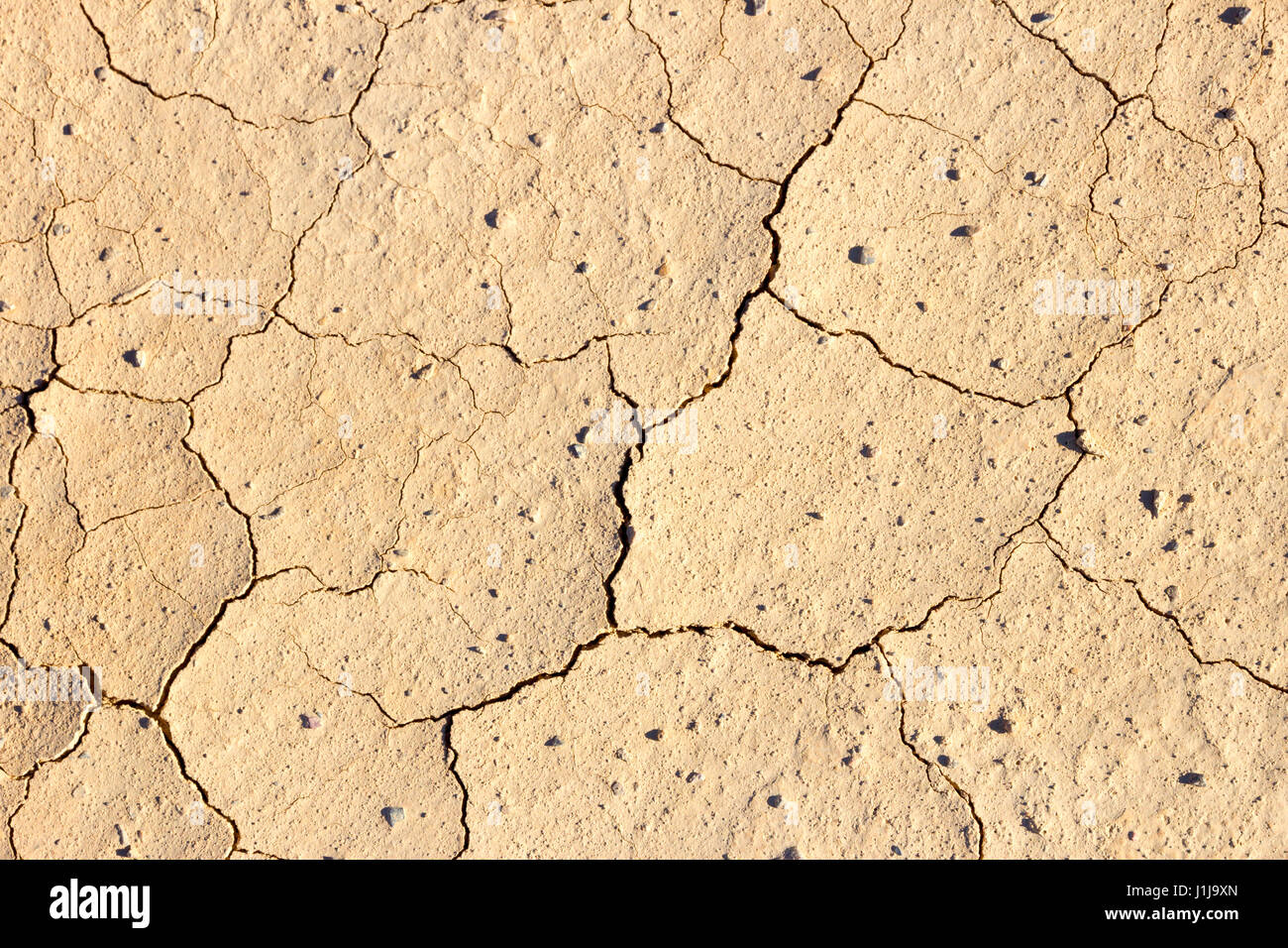 Surface of cracking dried brown terrain Stock Photo - Alamy