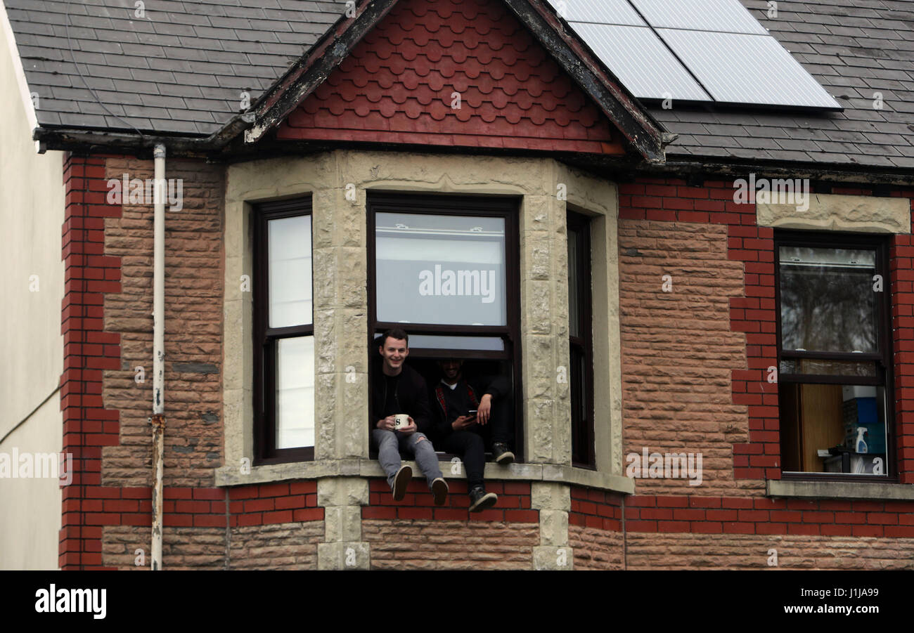 People watch from a window as Labour leader Jeremy Corbyn delivers a ...