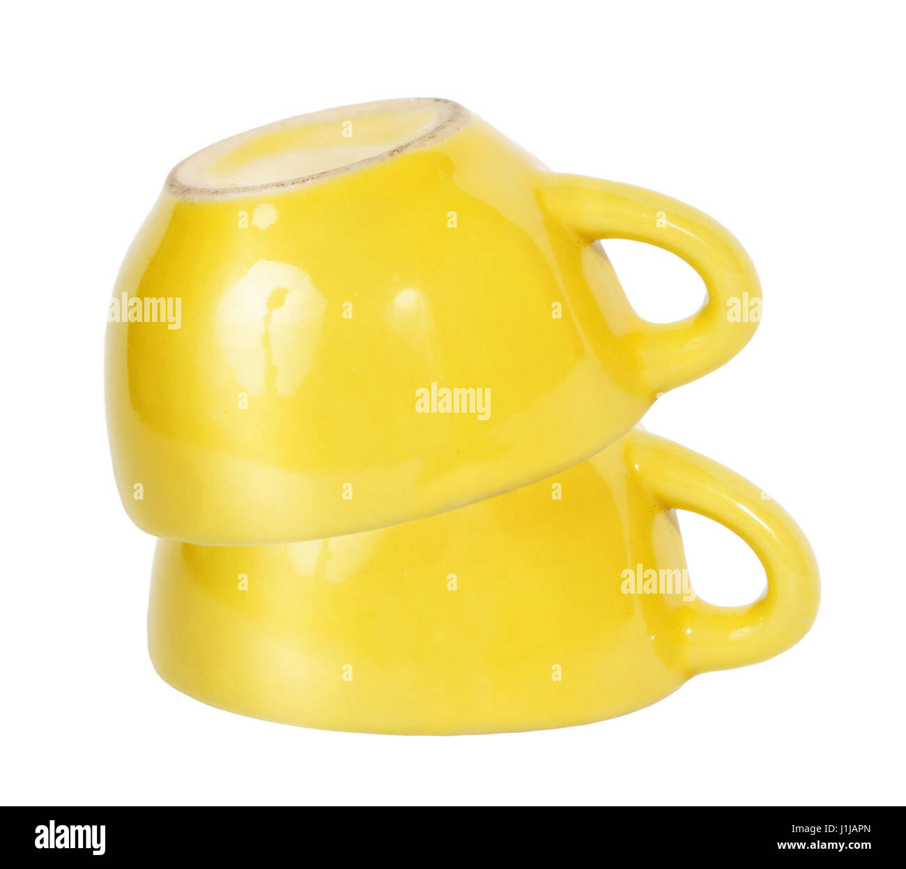 Two yellow cups isolated on white Stock Photo - Alamy