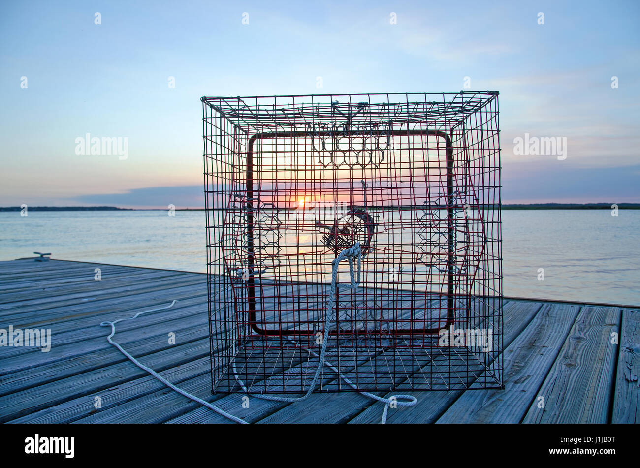 Sunset Viewed Through Crab Trap on South Carolina Dock Stock Photo - Alamy