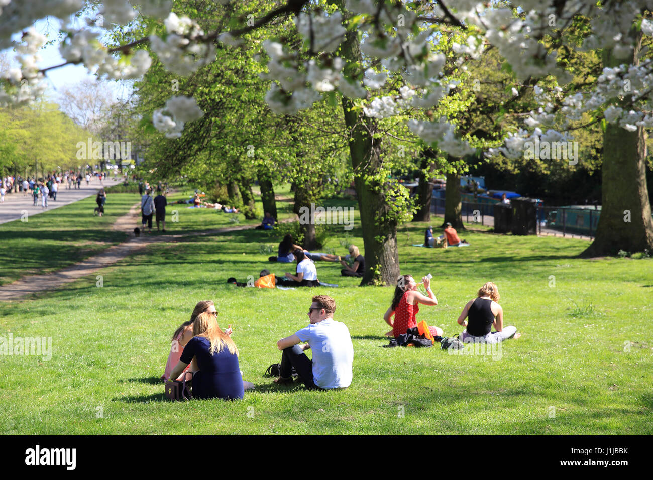 Relaxing in Victoria Park, in springtime, west of Grove Road, east ...