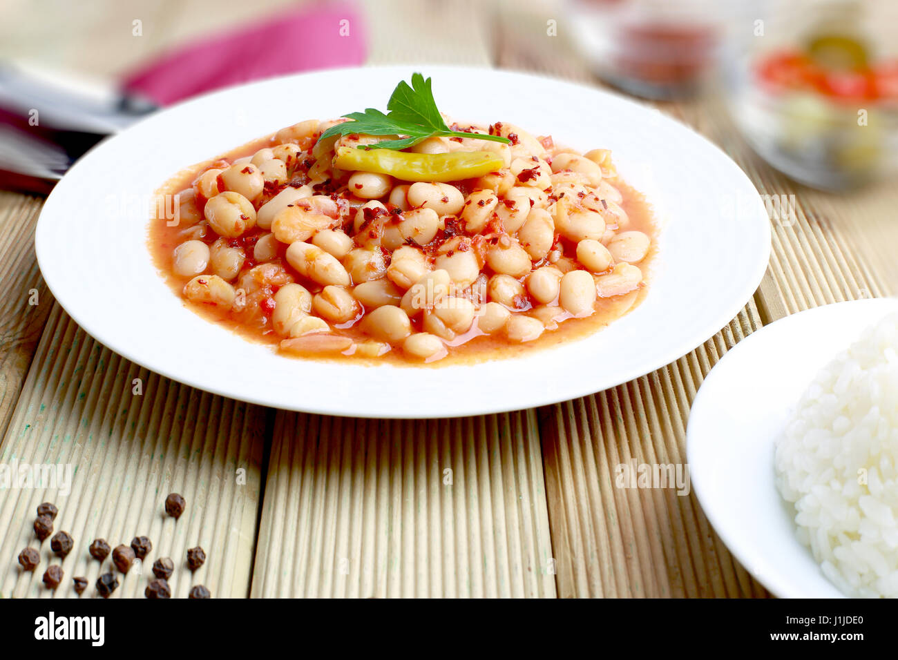 White beans stewed in tomato sauce Stock Photo - Alamy