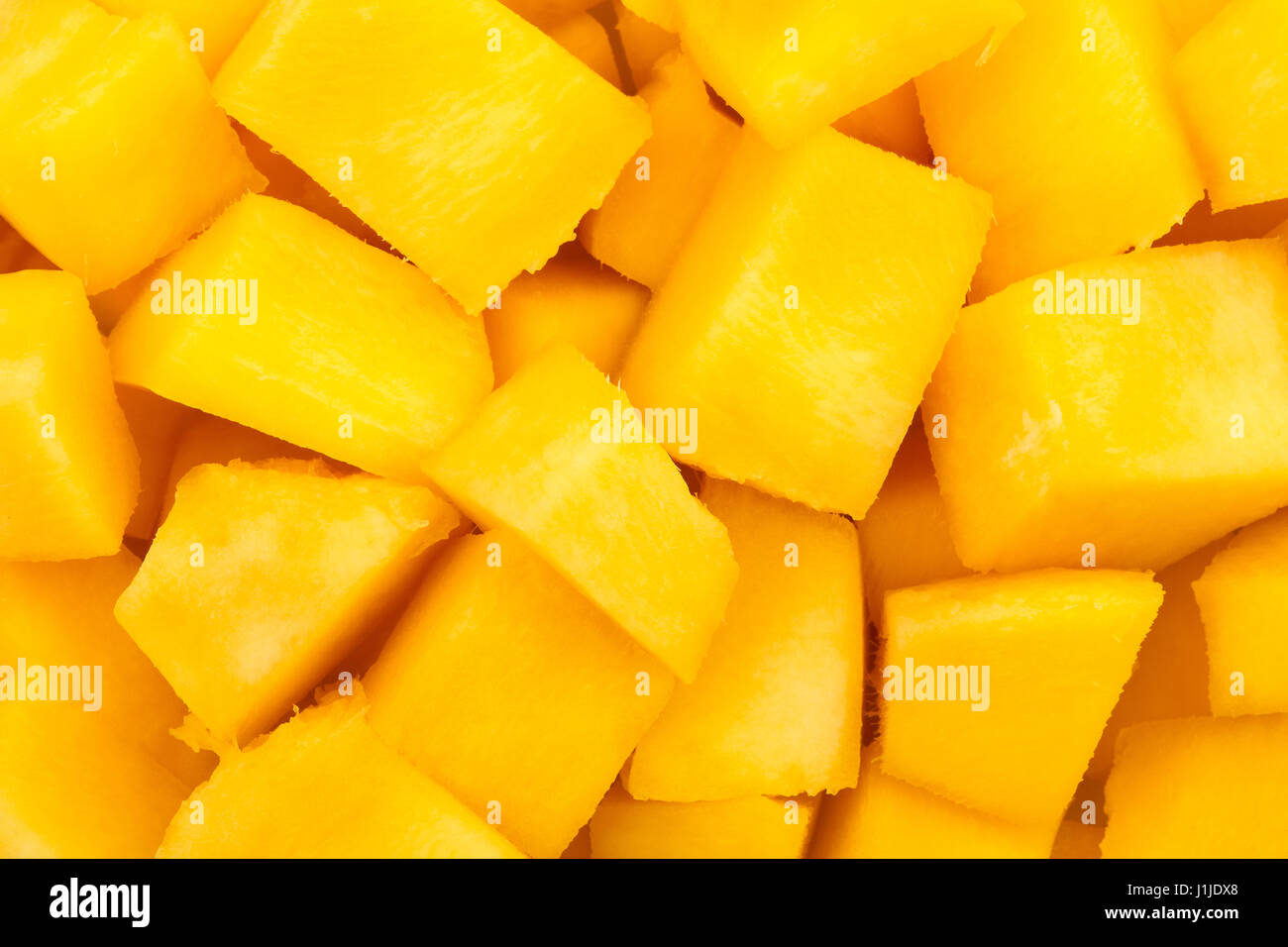 sliced mango chunks texture Stock Photo - Alamy