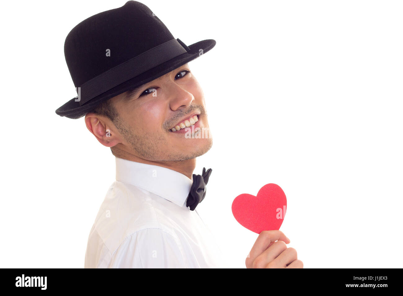 Young man holding a read heart Stock Photo - Alamy