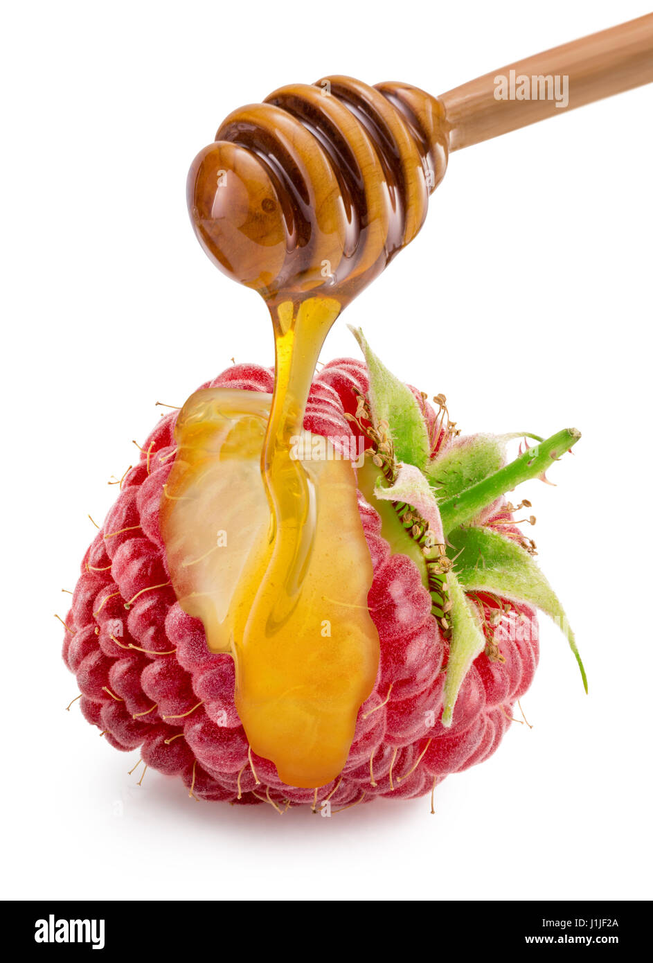 dripping honey on raspberry isolated on a white background Stock Photo ...