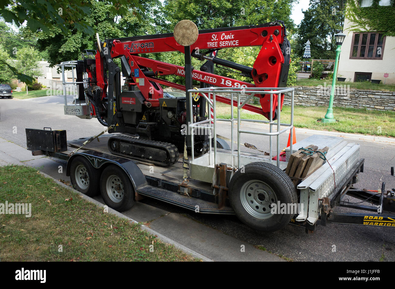 Cherry picker machine being transported on a trailer. St Paul Minnesota ...