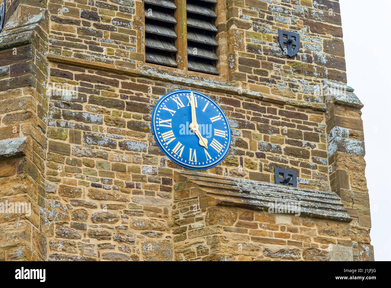 Day view English church 5 o'clock time Stock Photo - Alamy