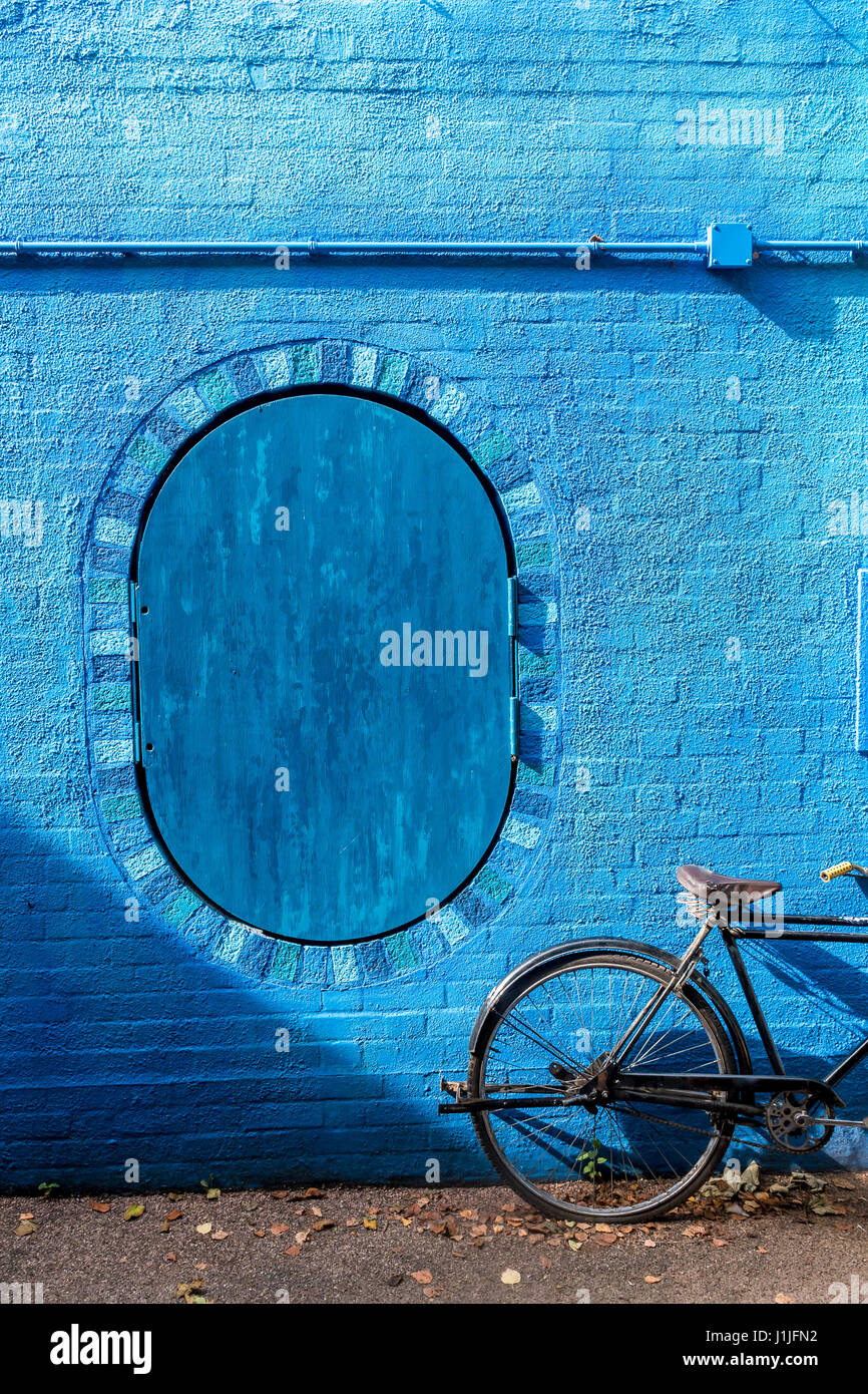 retro vintage bicycle old and blue wall background design Stock Photo ...