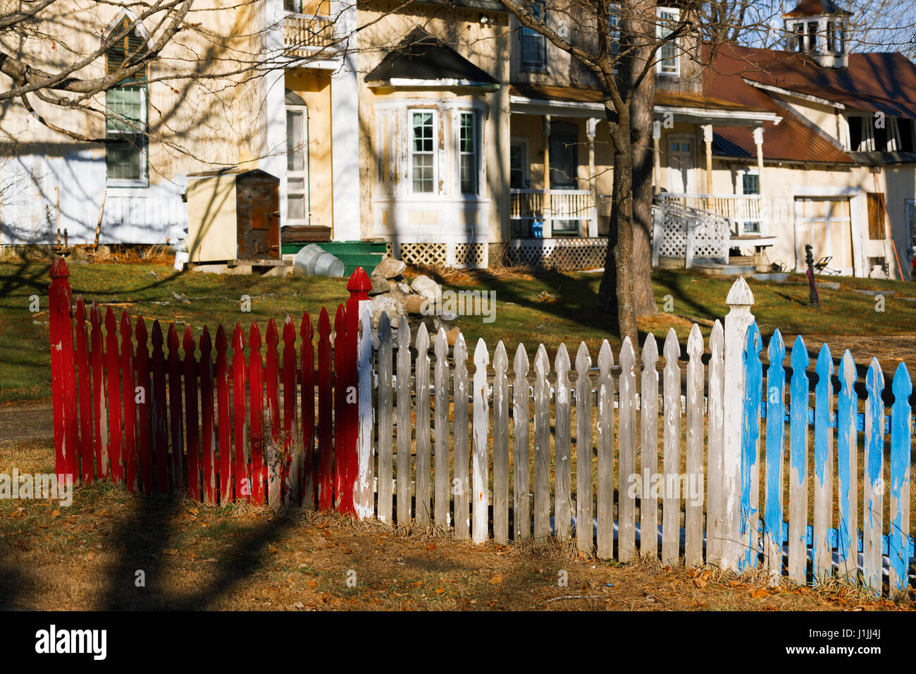 Colorful picket fence on a farmland Stock Photo - Alamy