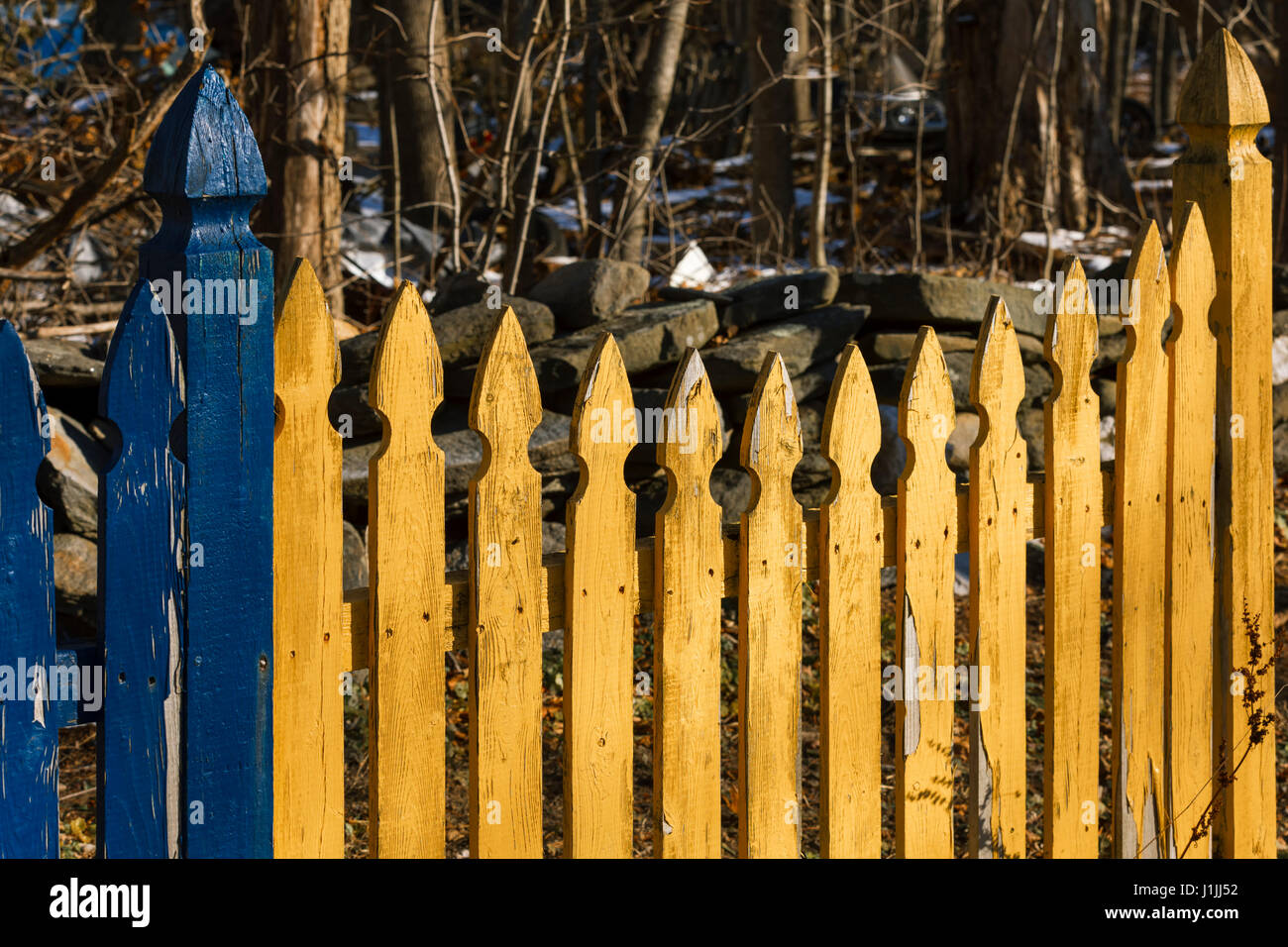 Colorful picket fence on a farmland Stock Photo - Alamy
