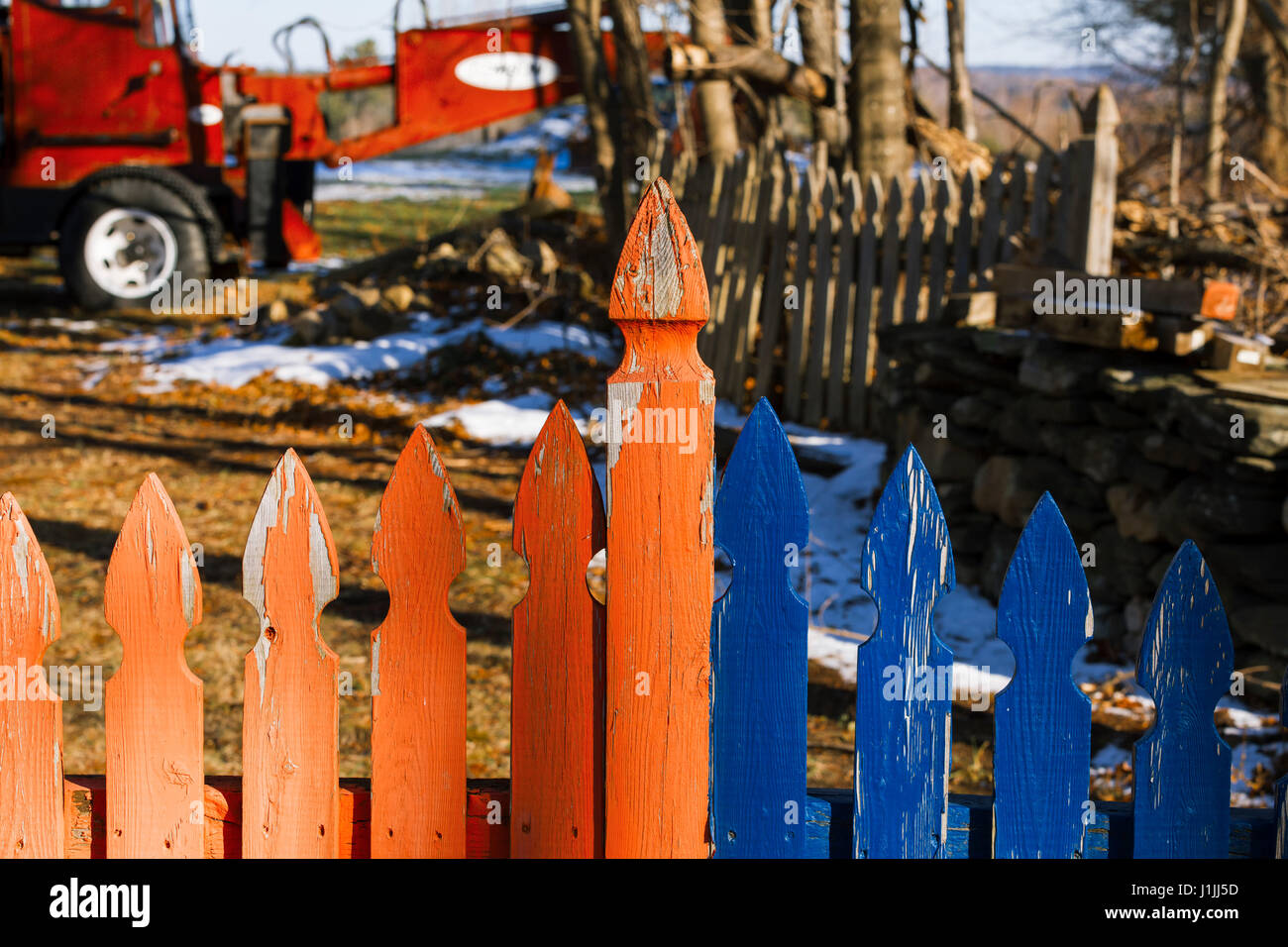 Colorful picket fence on a farmland Stock Photo - Alamy