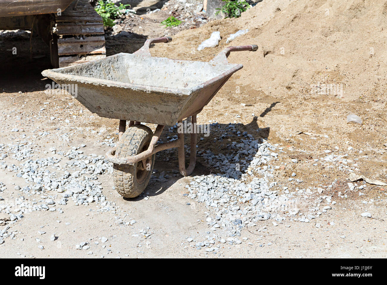 wheelbarrow in construction site Stock Photo - Alamy