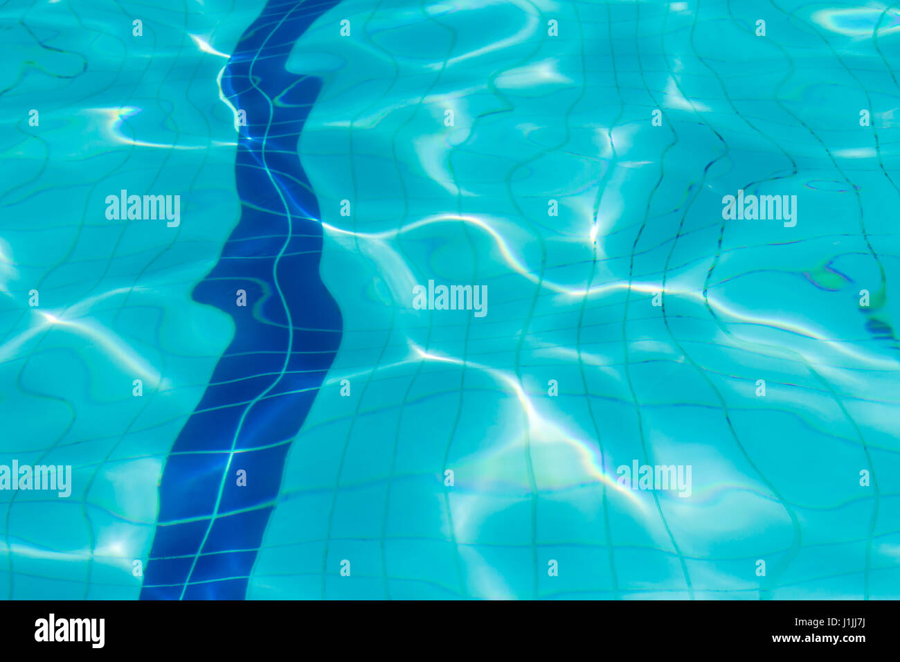 Blue ripple water in swimming pool Stock Photo - Alamy