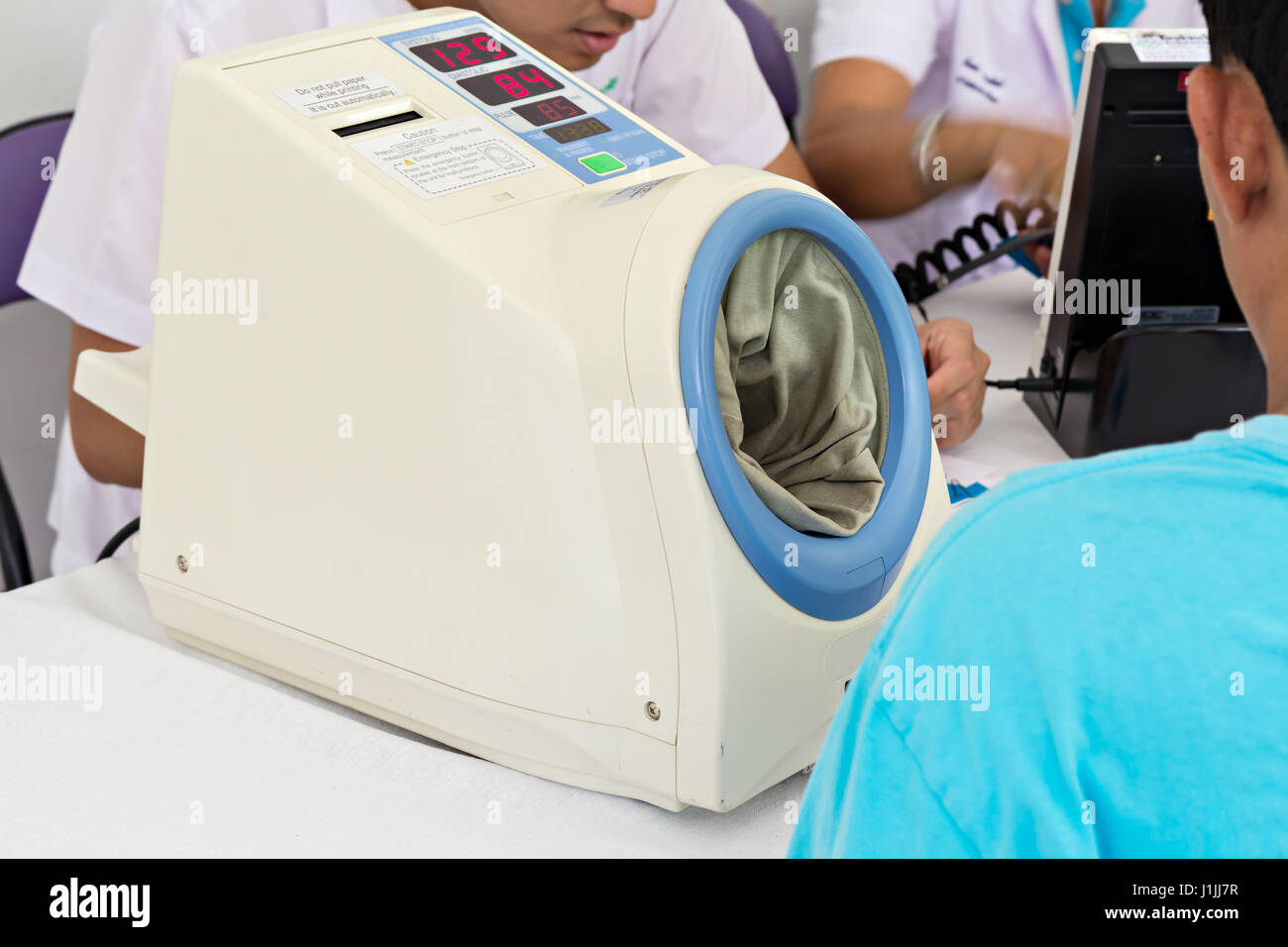 Automatic blood pressure monitor for health check Stock Photo - Alamy