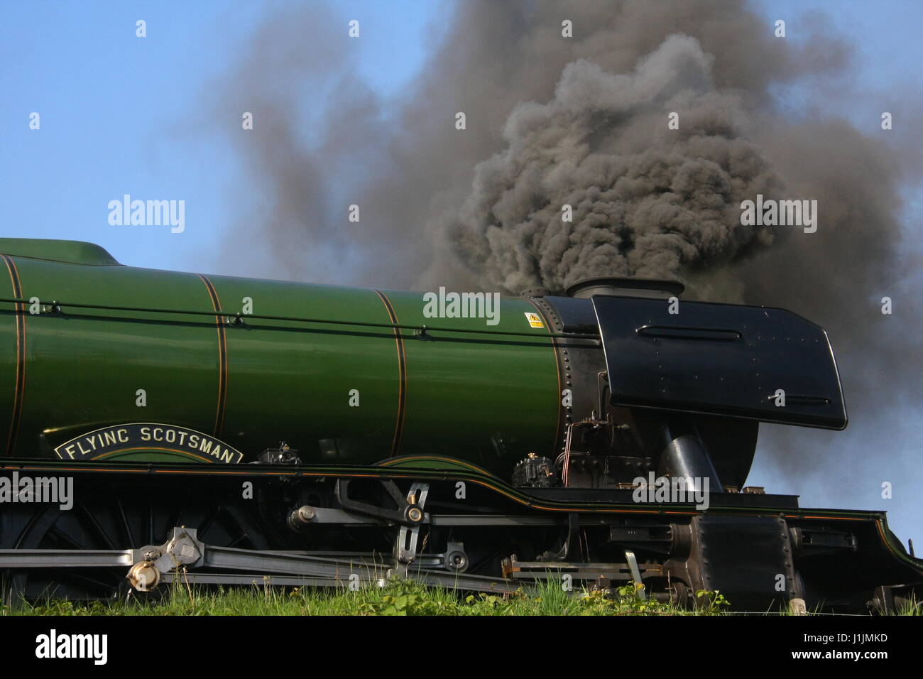 A SUNNY LANDSCAPE VIEW OF THE FRONT BOILER PART OF FLYING SCOTSMAN WITH ...