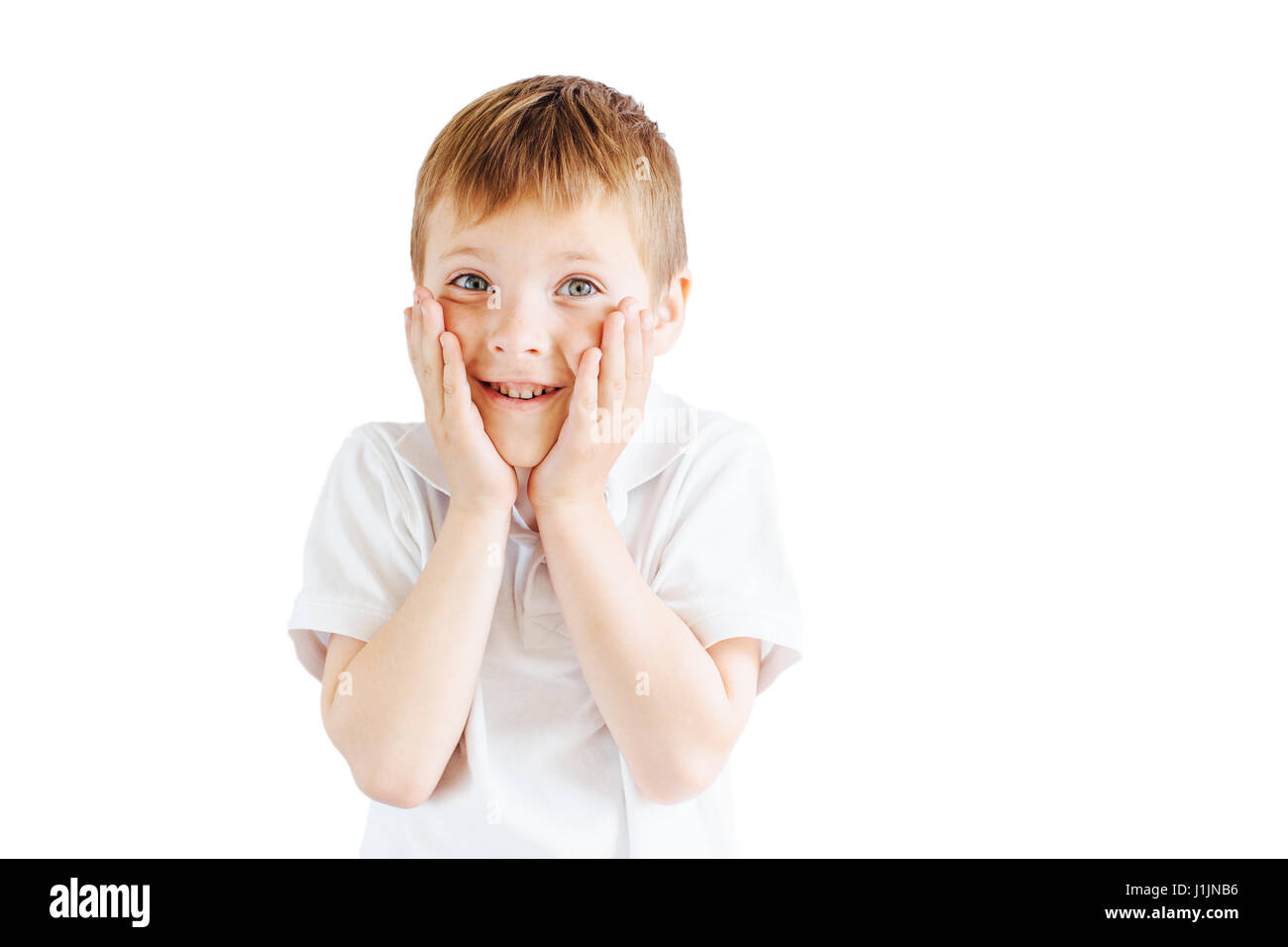 Little boy stand on white background and show his emotions Stock Photo ...
