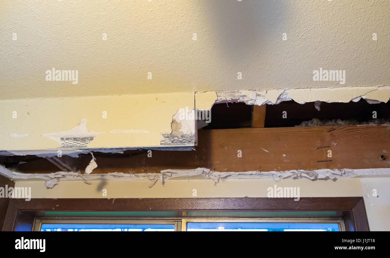 Major mess from a soffit demo during a home renovation and remodel in a ...