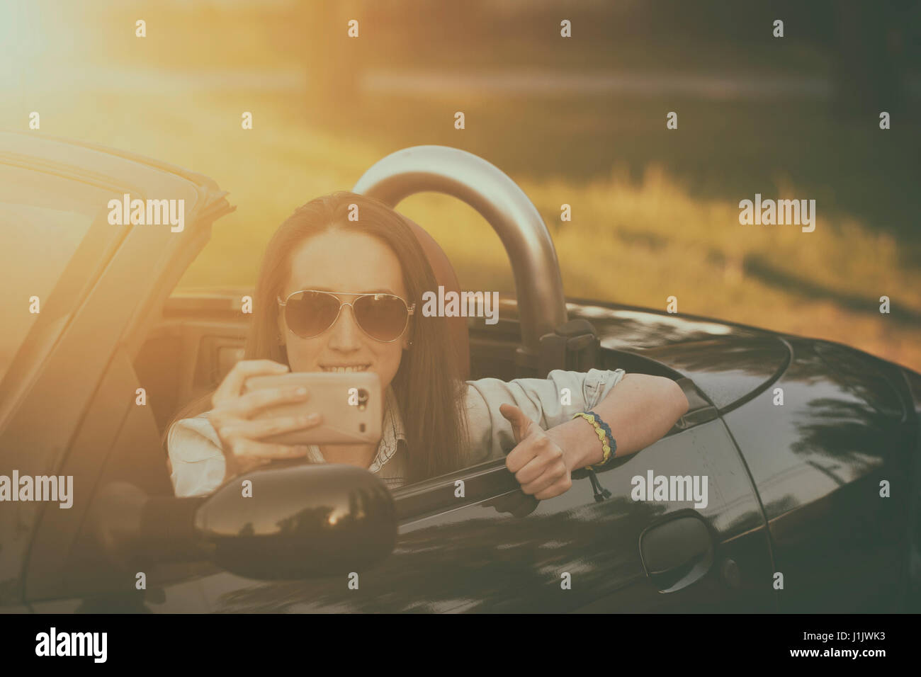 Woman driving car touch hi-res stock photography and images - Alamy