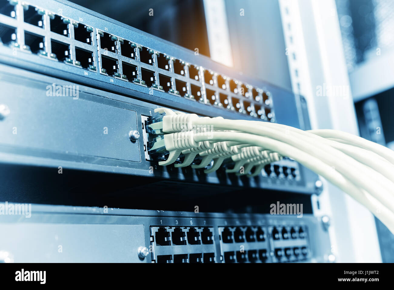 Network panel, switch and cable in data center Stock Photo - Alamy