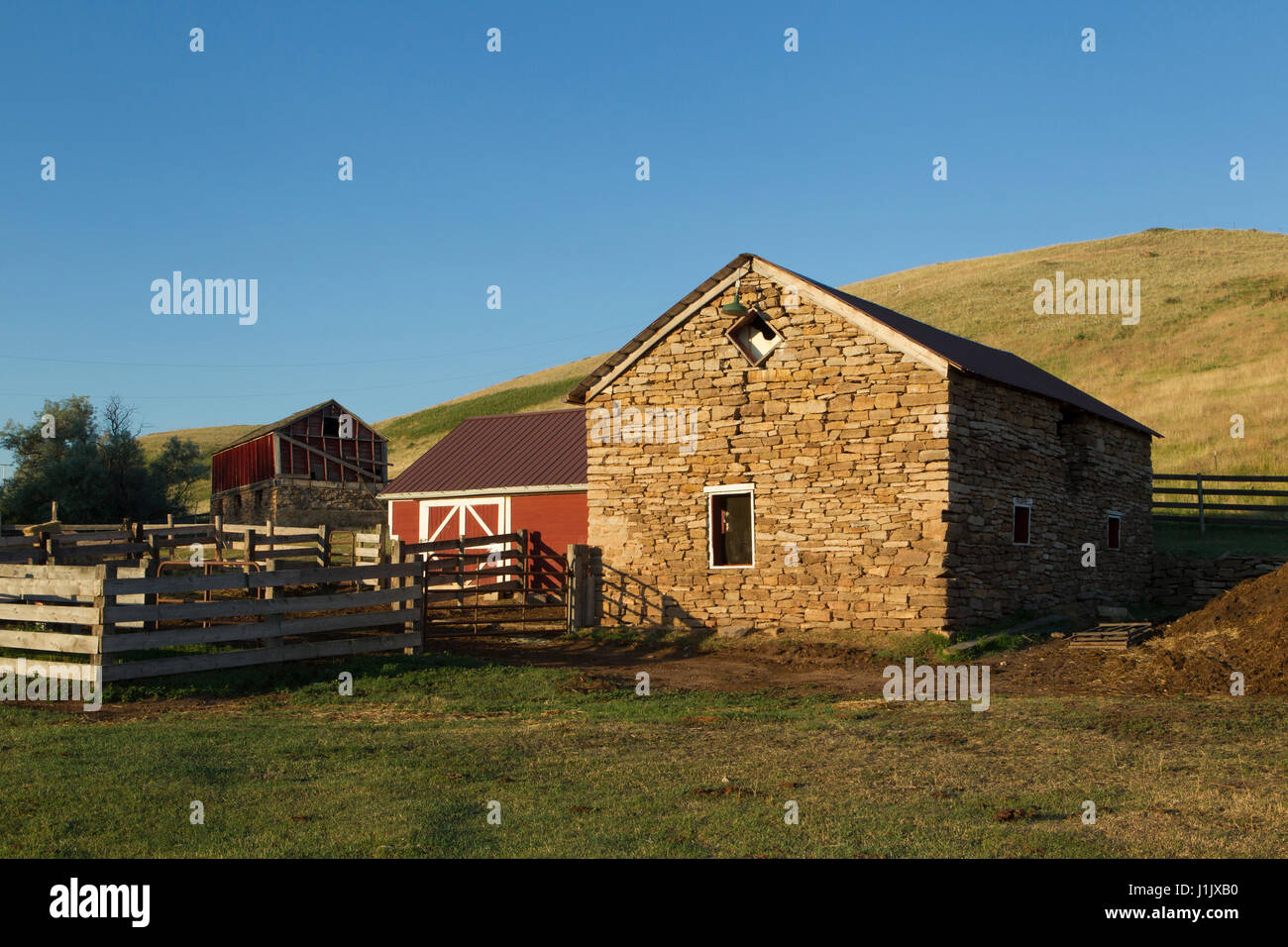 Corral and old stone barn, Nelson Ranch, Great Falls, MT Stock Photo ...