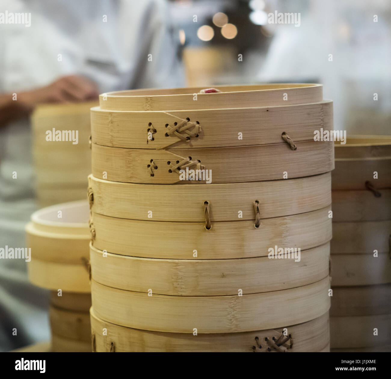 Dim sum bamboo basket containers in Chinese kitchen Stock Photo - Alamy