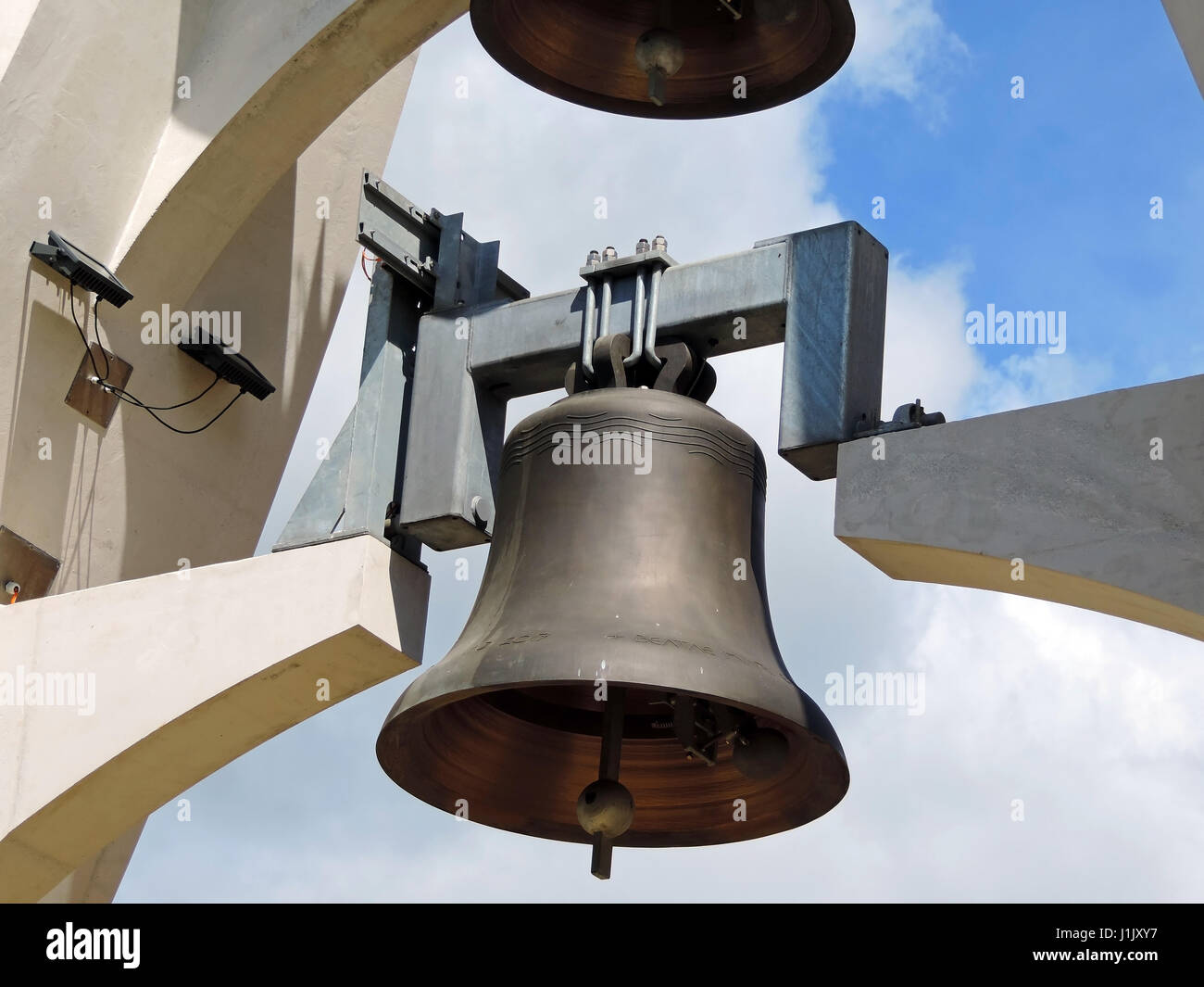 Detail of a large bronze bell of a chime Stock Photo - Alamy