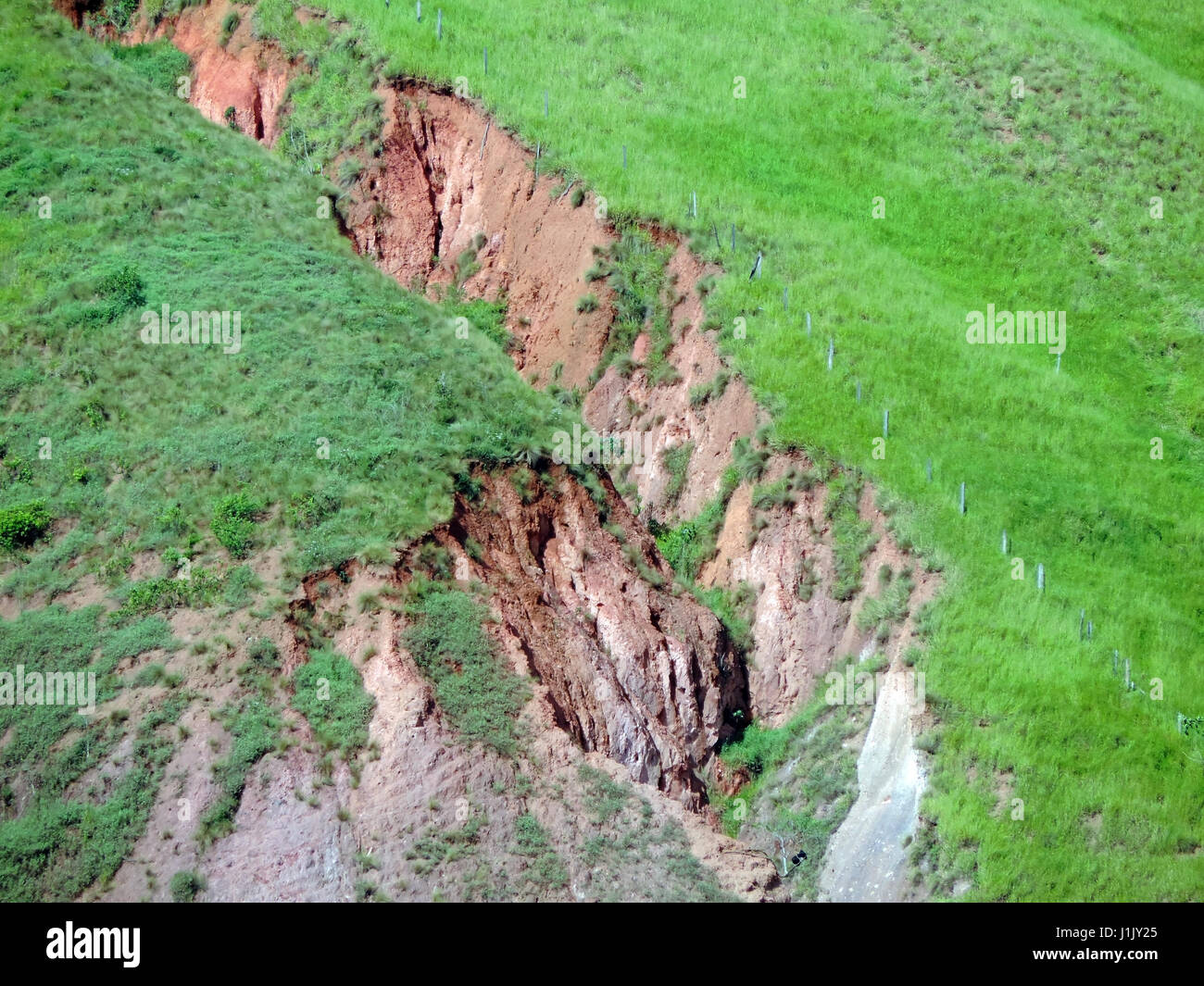 Land inclined and heavily worn by erosion Stock Photo - Alamy