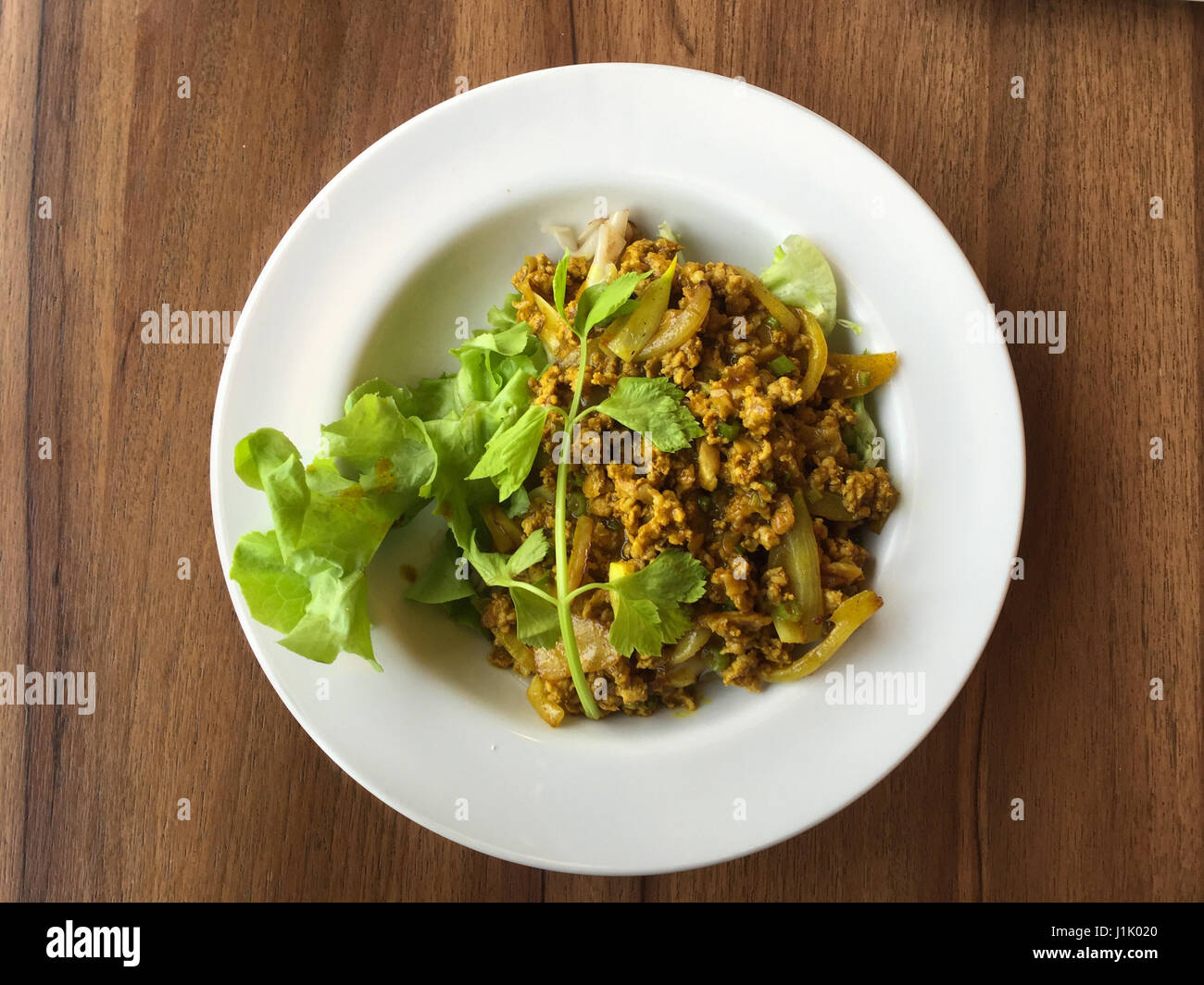 Flat lay photo of curry pork noodle in Thai style on wood table Stock ...