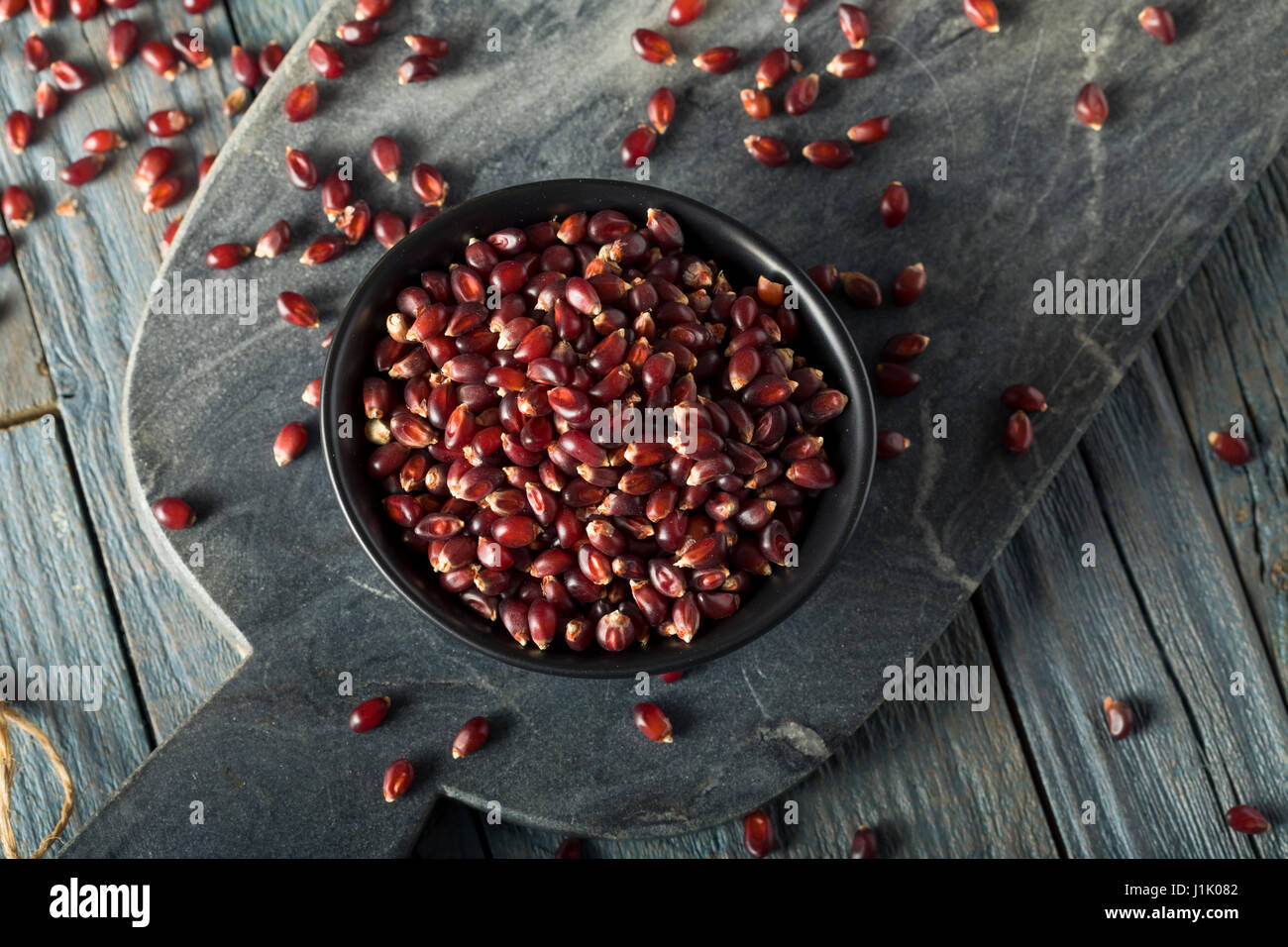 Raw Organic Ruby Red Pop Corn in a Bowl Stock Photo - Alamy