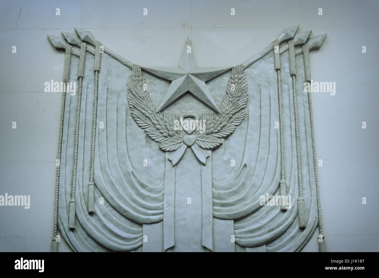 Chinese military symbol carved in white marble at a war memorial ...