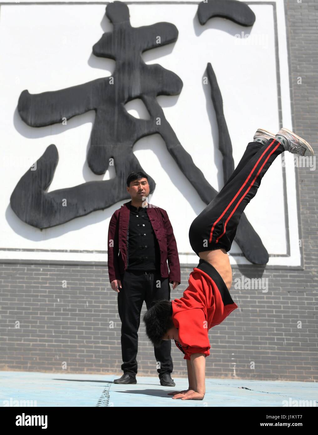 Pingliang, China's Gansu Province. 21st Apr, 2017. A coach instructs ...