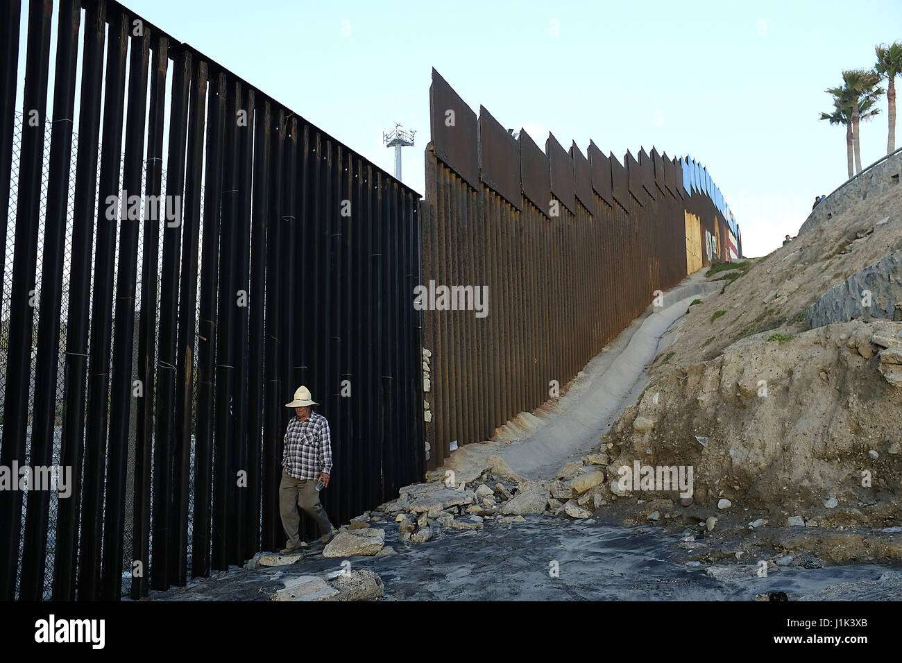 Tijuana, Baja Norte, Mexico. 22nd Feb, 2017. A man walks toward the ...