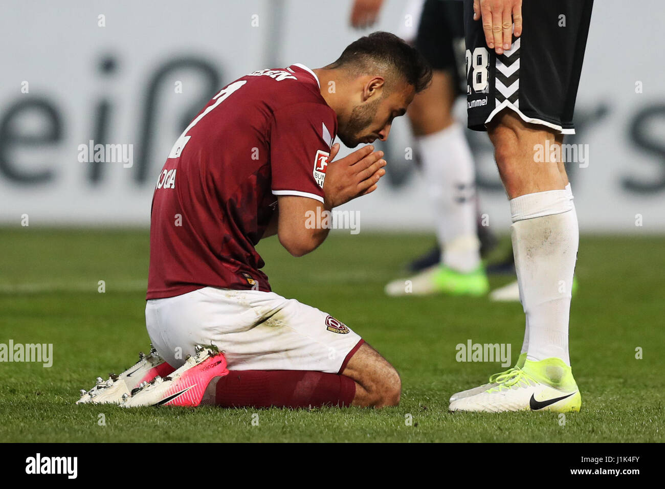 Fuerth, Germany. 21st Apr, 2017. Dresden's Akaki Gogia kneels after a ...