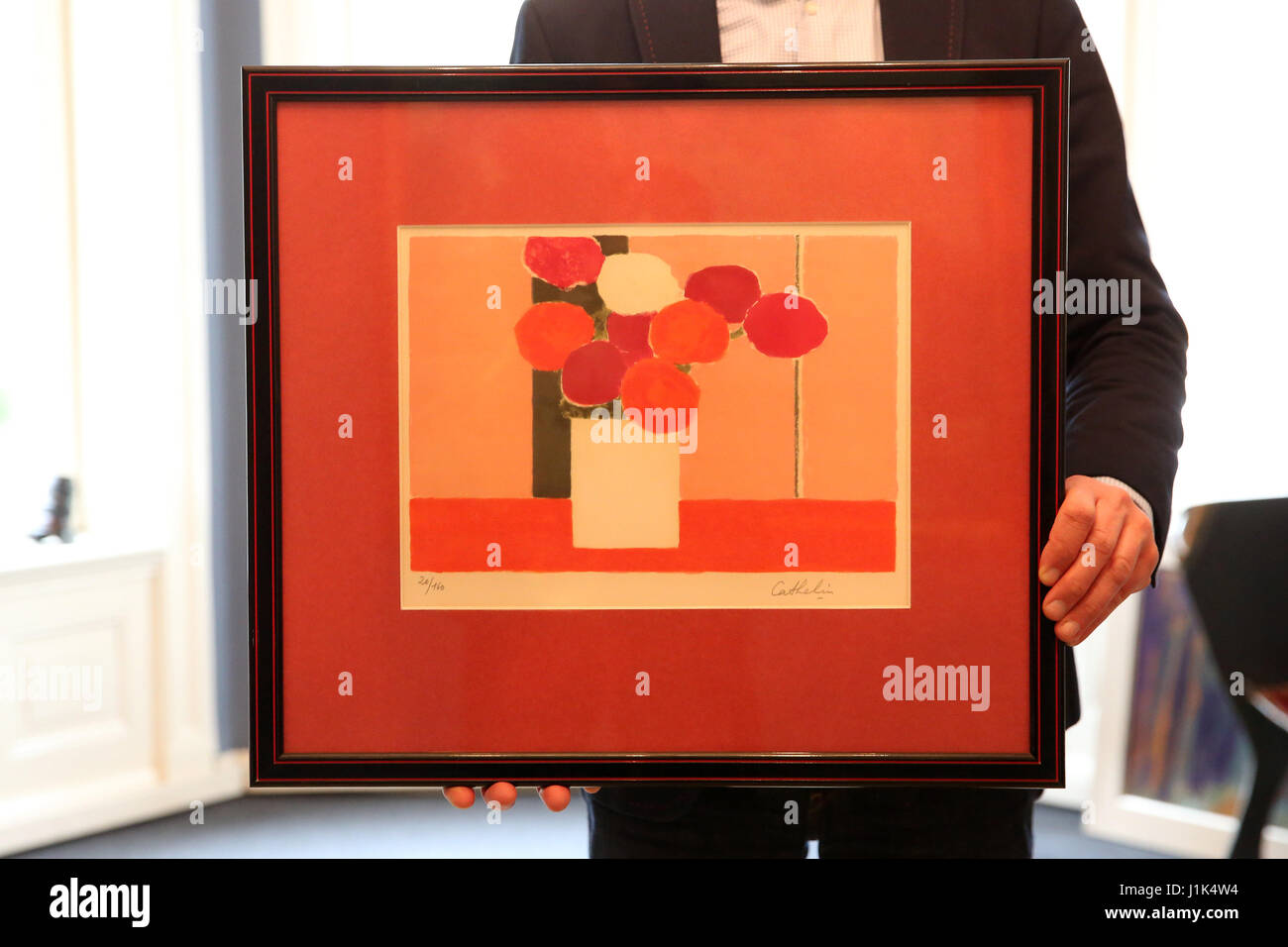 Hamburg, Germany. 21st Apr, 2017. Auctioneer Michael Kerle holding a ...