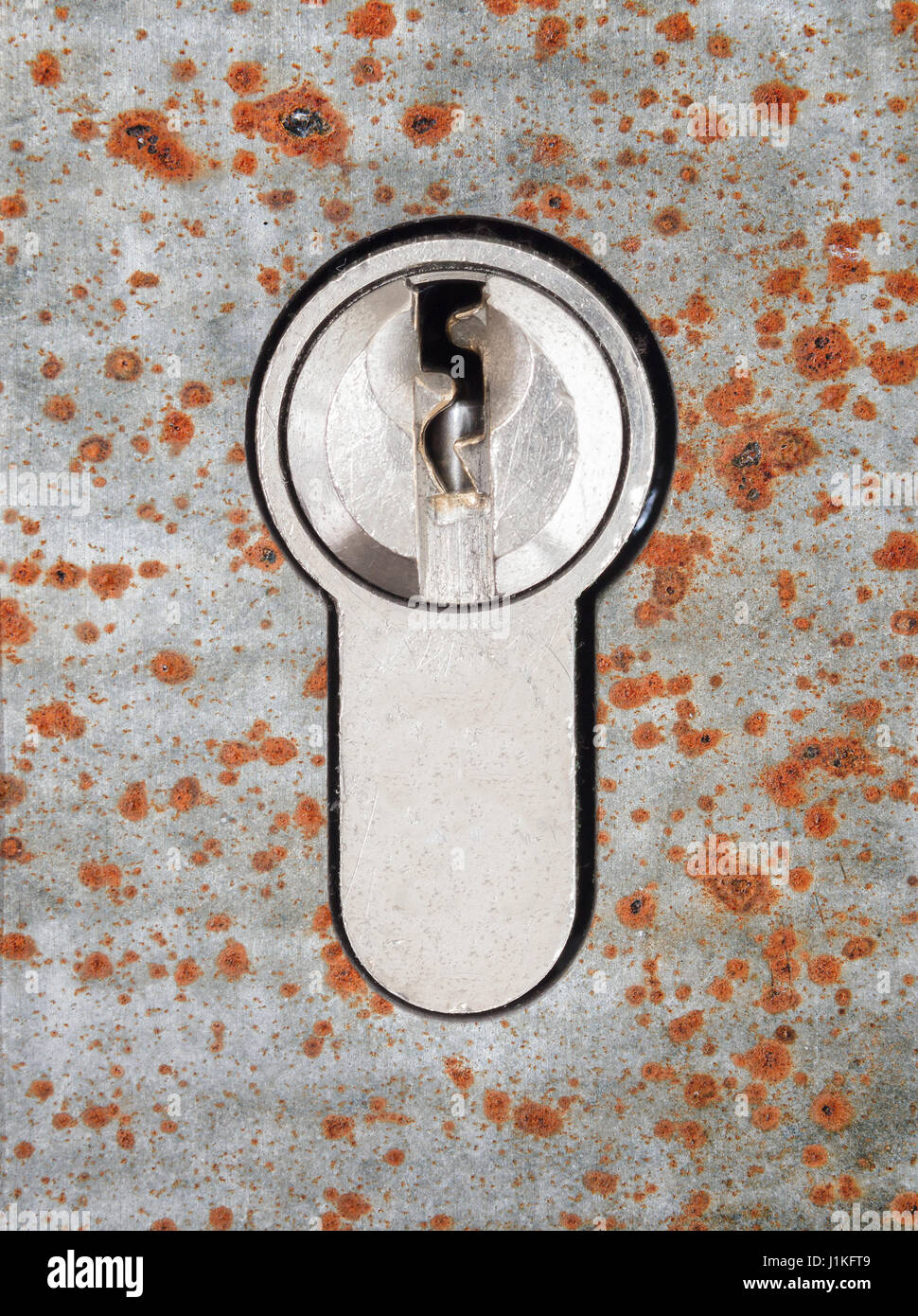 Cylinder lock closeup, rusty, cylinder in the middle Stock Photo - Alamy