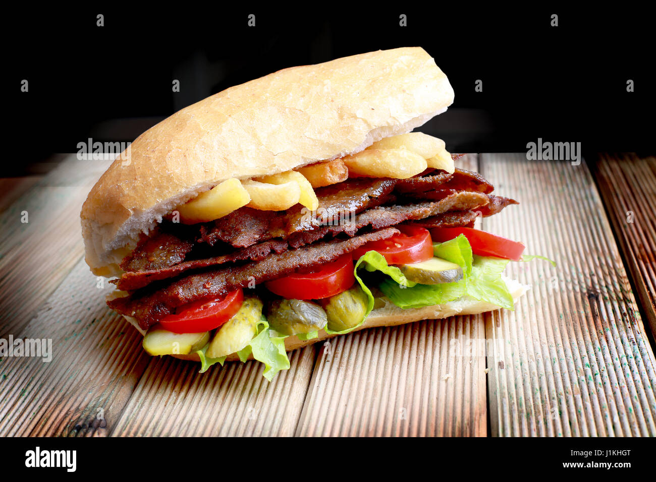 Grilled meat and vegetables in bread. Traditional turkish doner kebab ...