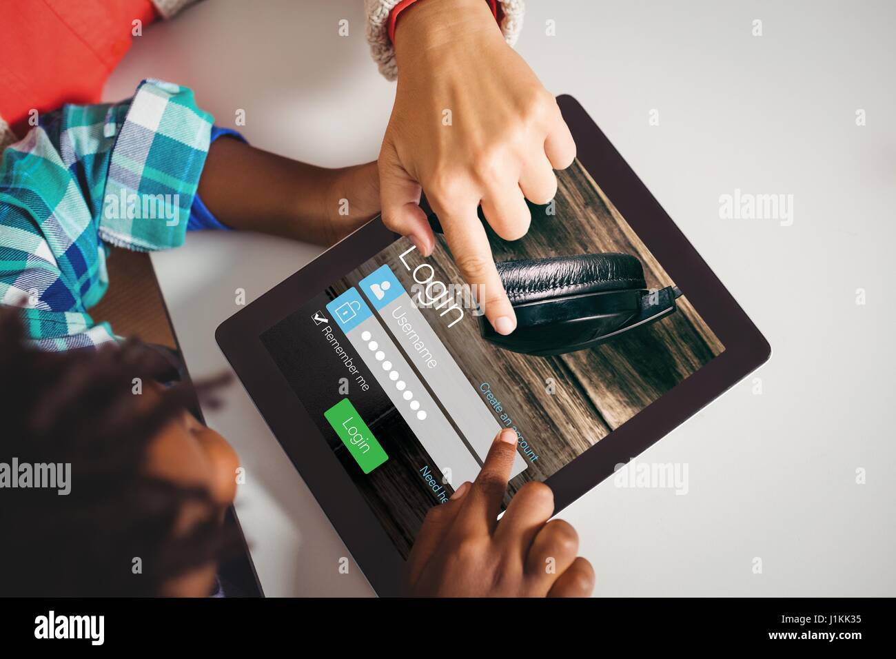 Digital composite of Top view of hand pointing at tablet screen Stock ...