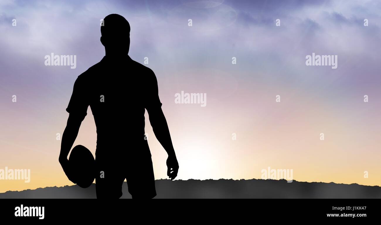Digital composite of Silhouette sportsman holding rugby ball during ...