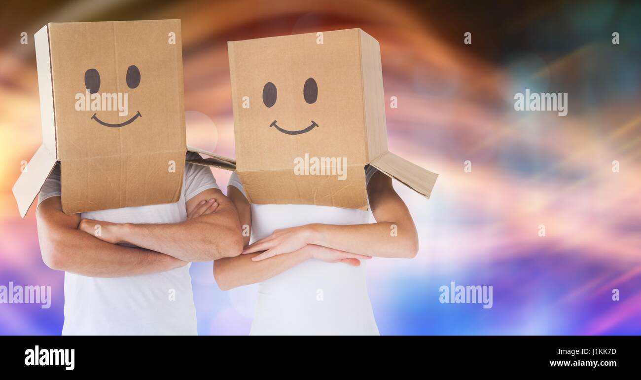 Digital composite of Couple wearing cardboard boxes on head with ...