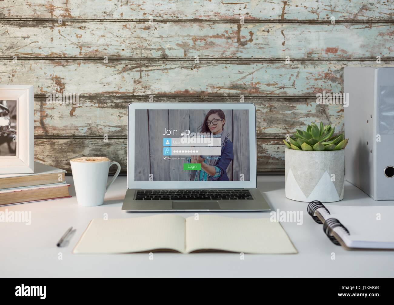 Digital composite of Laptop on a white desk with wood wall. Login ...
