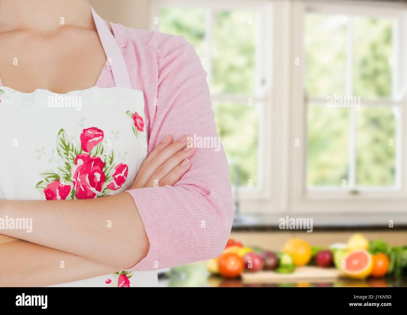 Digital composite of cook woman hand folded in the kitchen. Fruit a ...