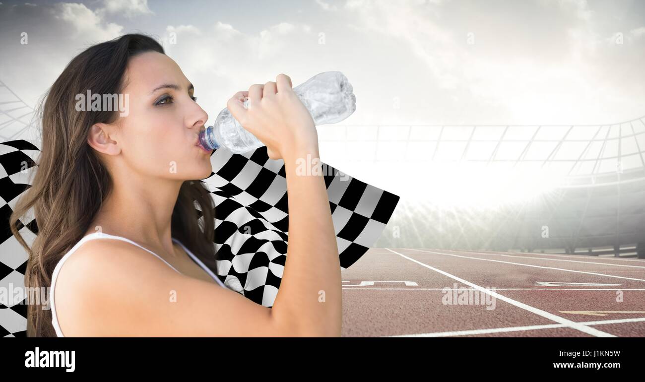 Digital composite of Female runner drinking on track against flares and ...