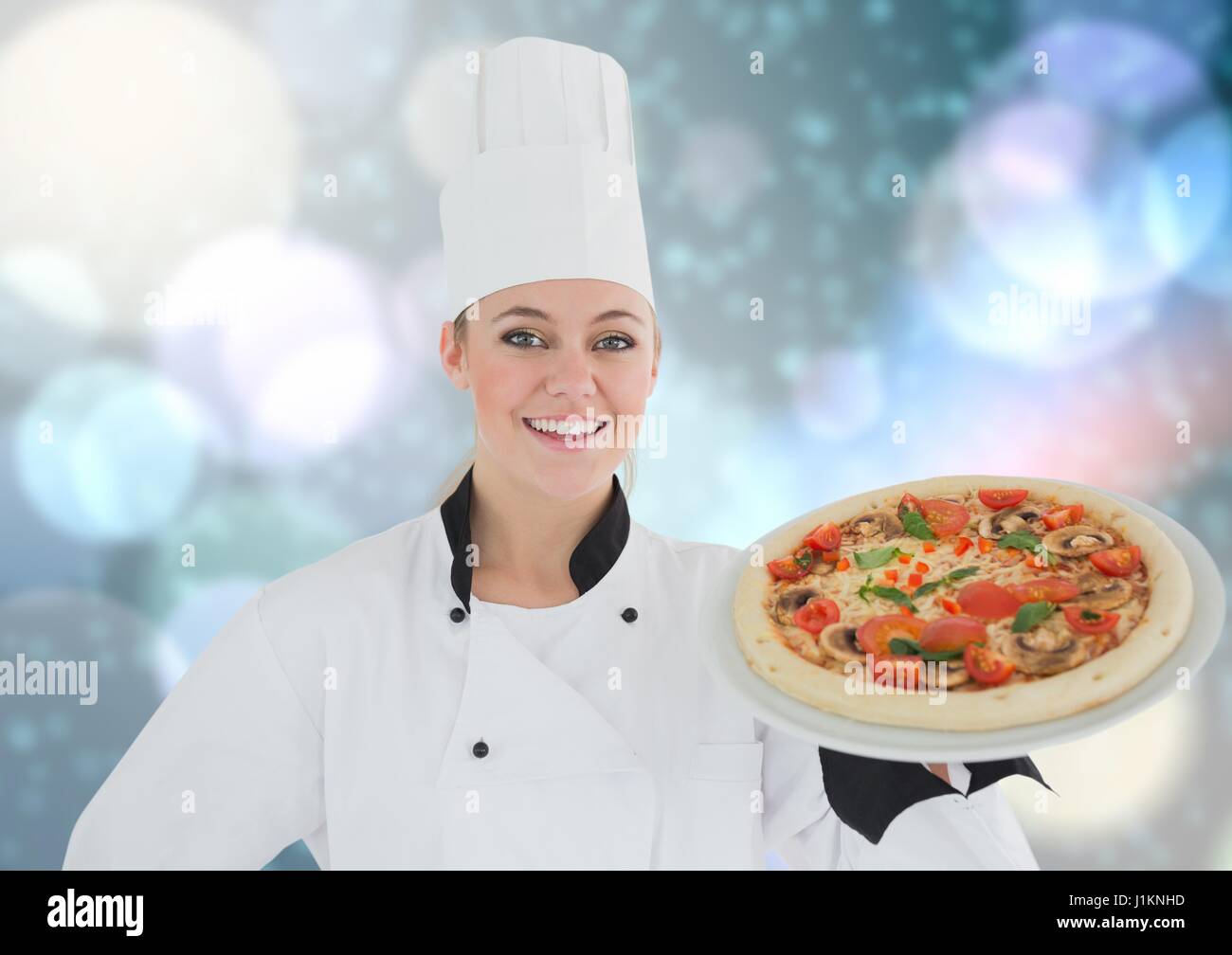 Digital composite of Chef with pizza. Lights background Stock Photo - Alamy
