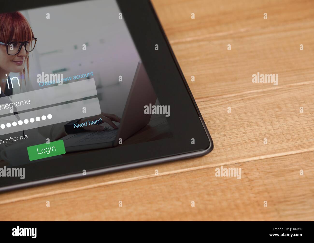 Digital composite of tablet with login screen in a table Stock Photo ...