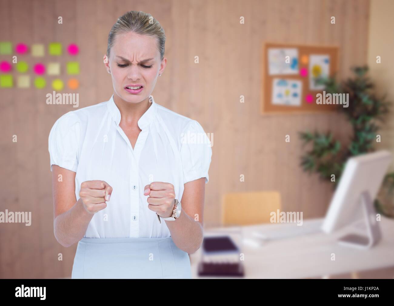 Digital composite of Angry business woman in her office Stock Photo - Alamy