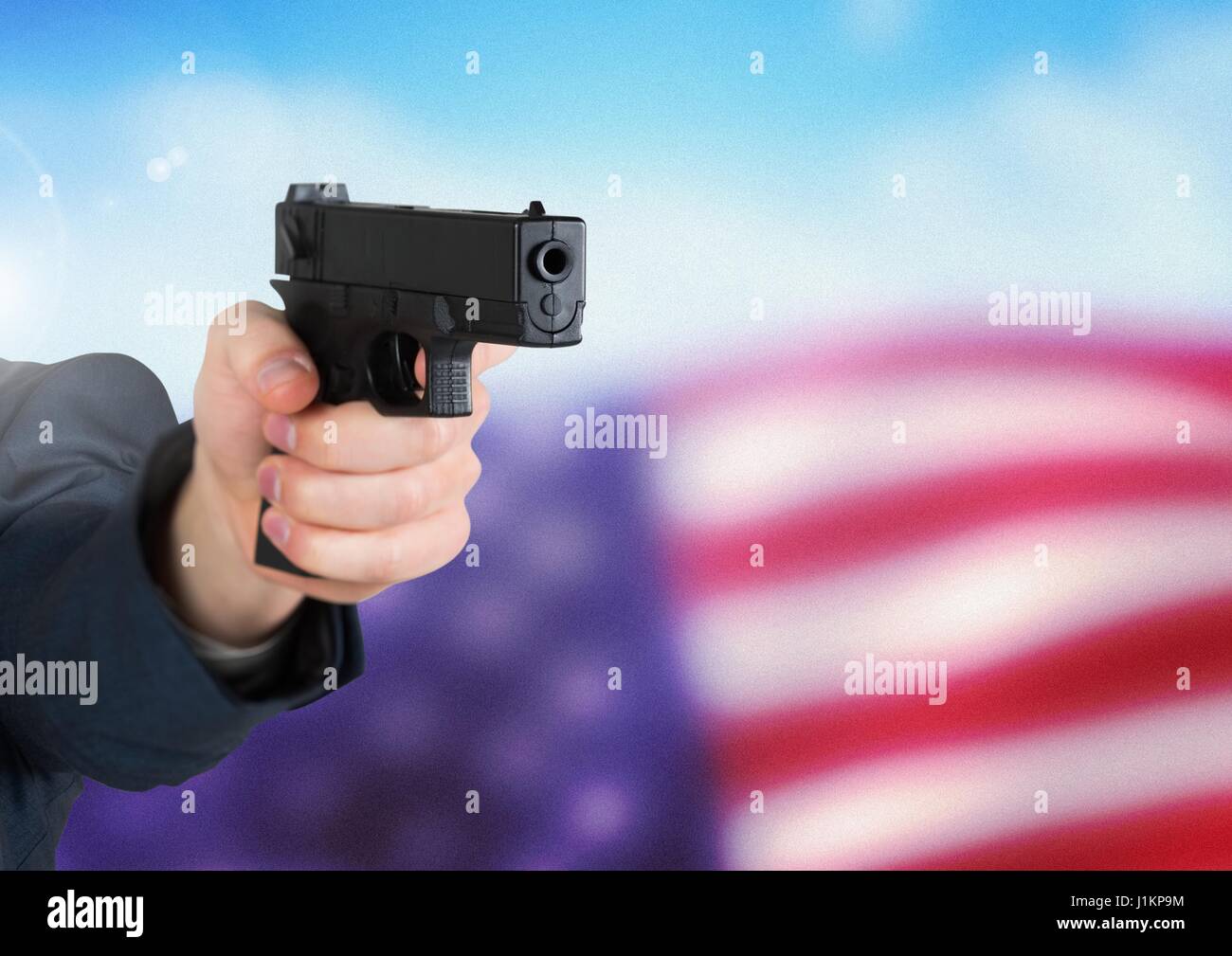 Digital composite of Hand holding gun with American flag Stock Photo ...