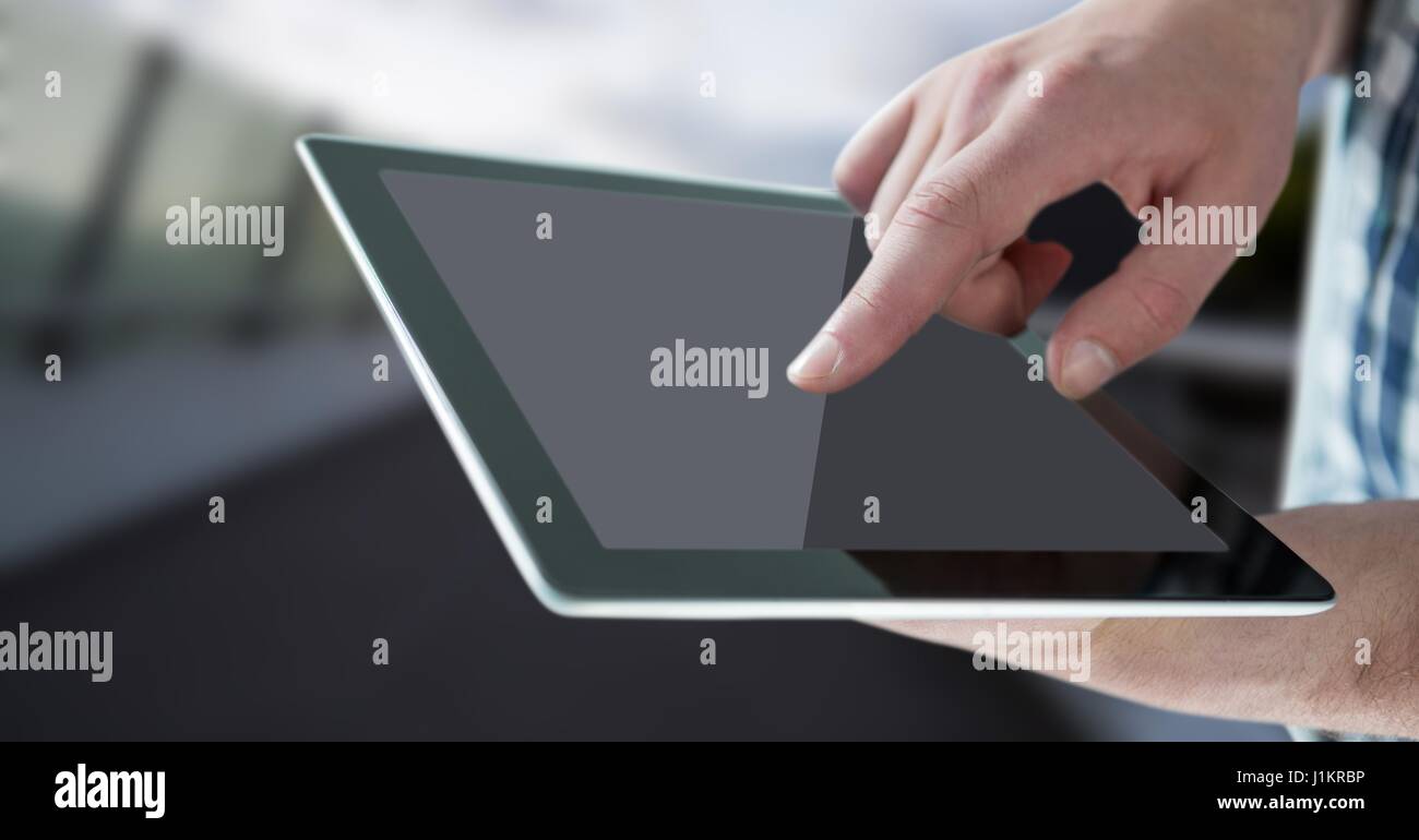 Digital composite of Hand with tablet against blurry bridge Stock Photo ...